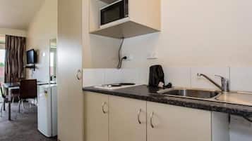 Suíte estúdio luxo, vista para o jardim | Cozinha americana privada | Geladeira, micro-ondas, fogão, cooktop