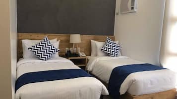 Quarto standard | Roupas de cama antialérgicas, frigobar, cofres nos quartos, escrivaninha