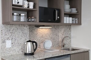 Apartamento família, 2 quartos, para não fumantes | Cozinha americana privada | Geladeira, micro-ondas, chaleira elétrica