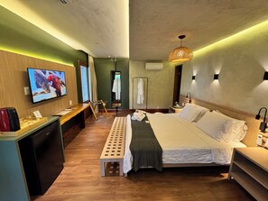 Suite Ipê | Frigobar, berços grátis, Wi-Fi de cortesia, roupa de cama