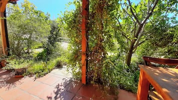Quarto casal superluxo, vista para o jardim | Terraço/pátio