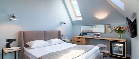 Suíte júnior | Área de estar | TV de tela plana