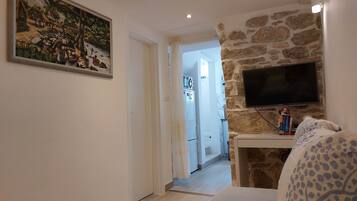 Estúdio | Área de estar | TV de tela plana