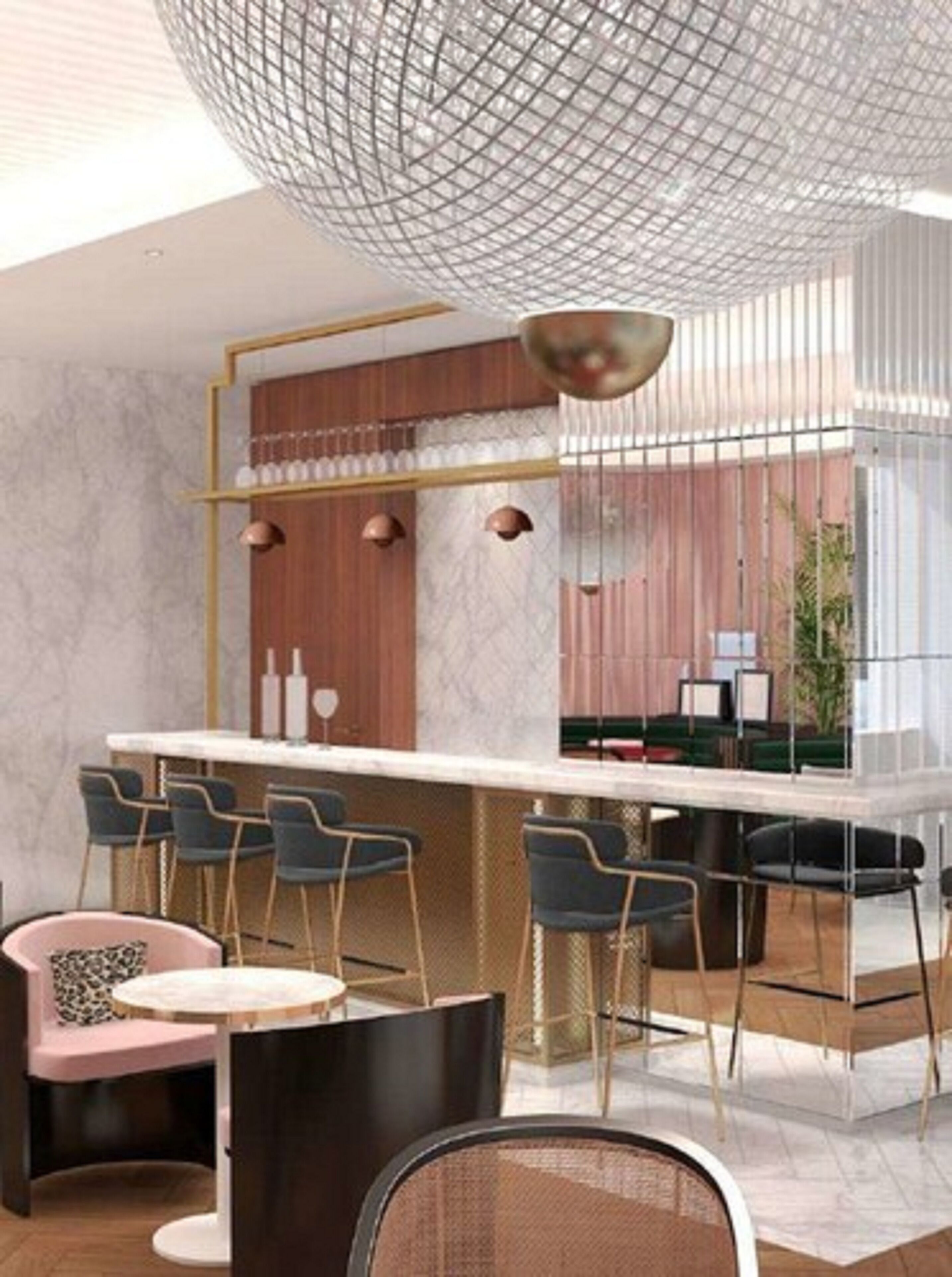 Uma área de bar moderna com pé direito alto, banquetas e um espaço de estar com mesas redondas e cadeiras.