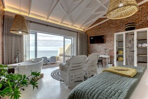 Quarto casal executivo, 1 cama King, vista para o oceano | Frigobar, individualmente decorados, individualmente mobiliados
