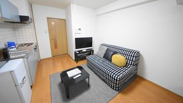 Quarto Deluxe (503) | Sala de estar | TV de ecrã plano