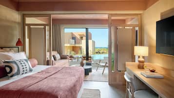 Junior Suite Swim-Up | Minibar, cofre no quarto, cortinas/cortinados opacos