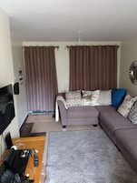 Quarto luxo | Sala de estar | TV