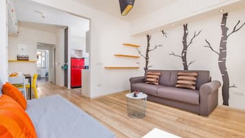 Apartamento Familiar | Sala de estar | TV de ecrã plano