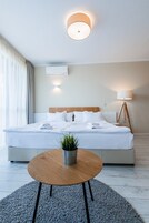 Quarto casal ou duplo luxo, vista para o mar | Área de estar