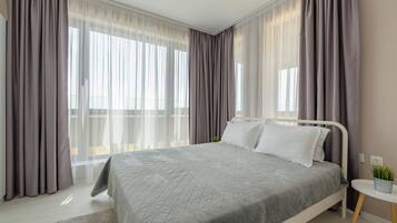 Apartamento Deluxe, 2 quartos | Sala de estar