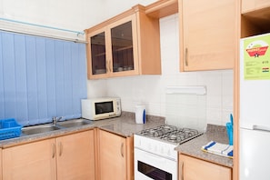 Apartamento Exclusivo, 2 camas de casal | Cozinha privada | Um frigorífico/congelador grande, um micro-ondas, um forno 