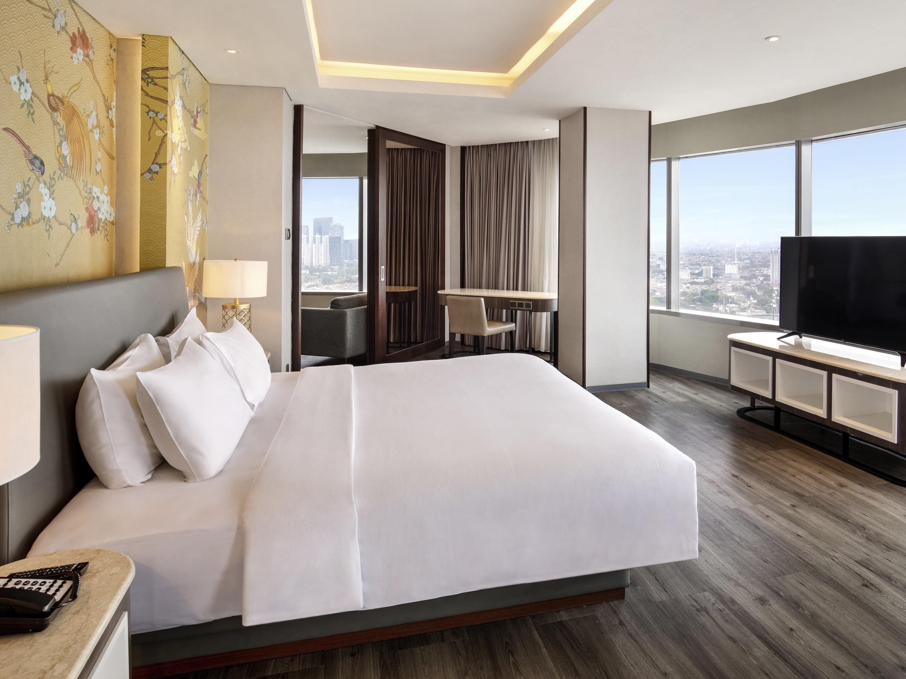 Suíte executiva, 1 cama King | Camas Select Comfort, frigobar, cofres nos quartos, escrivaninha
