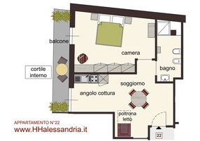 Planta baixa de um apartamento com varanda, cozinha, sala de estar, banheiro e quarto.