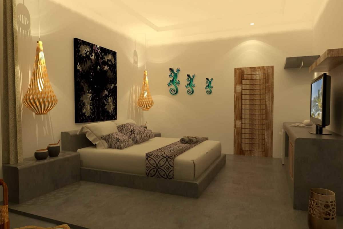 Quarto moderno com uma cama grande, duas luminárias pendentes, uma TV e arte decorativa na parede.