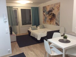 Apartamento, sauna seca | Área de estar | TV de tela plana