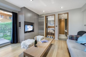 Apartamento, suíte (Residence Les Sapins) | Área de estar | TV de tela plana