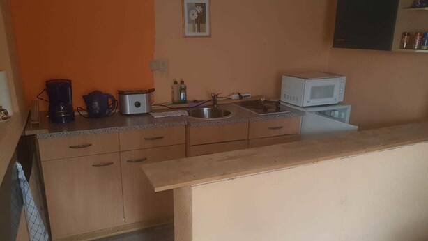 Apartamento | Cozinha privada | Geladeira, micro-ondas, cooktop