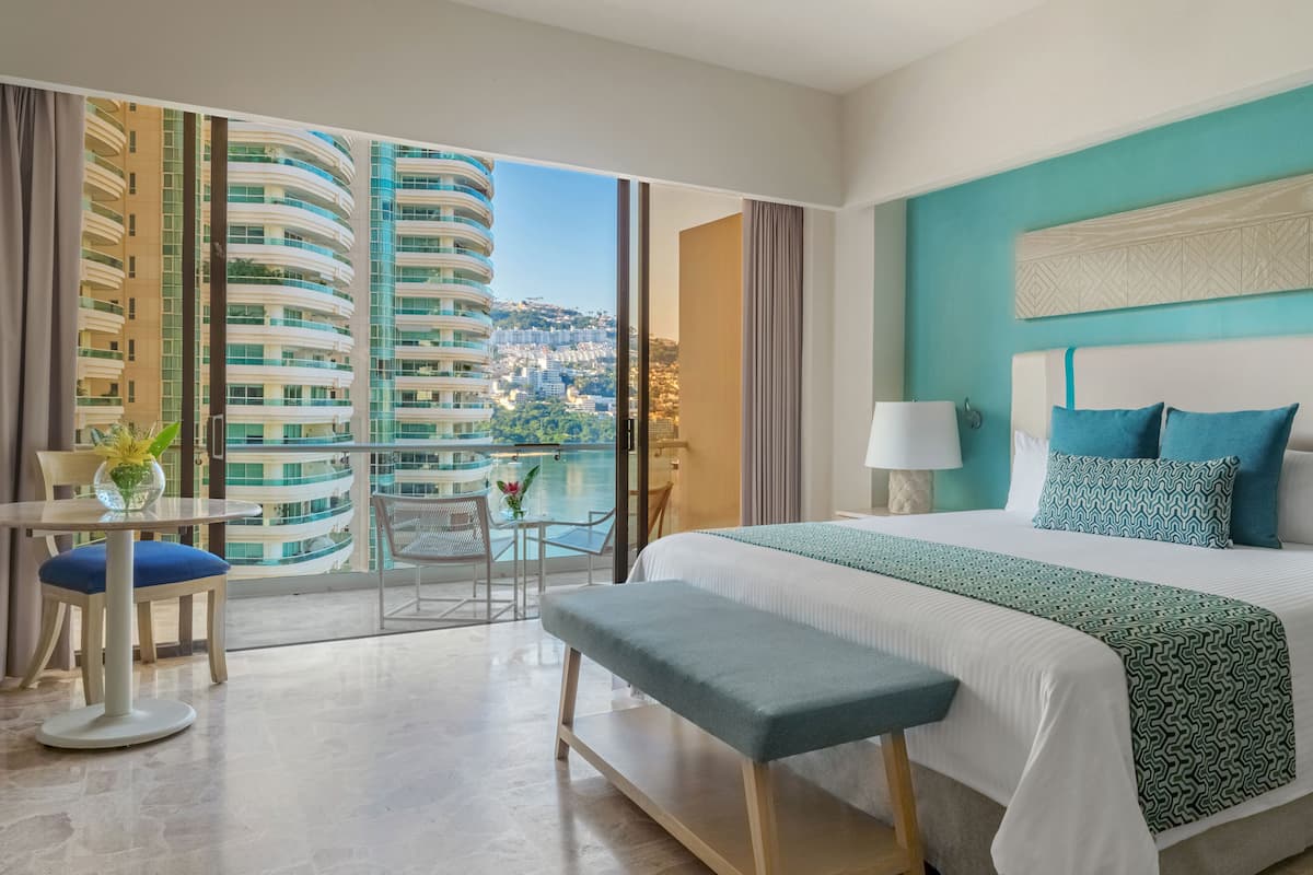 Quarto Deluxe, 1 cama king-size, vista parcial para o oceano | Minibar, cofre com capacidade para portátil