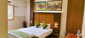 Quarto executivo | Escrivaninha, cortinas blackout, Wi-Fi de cortesia, roupa de cama