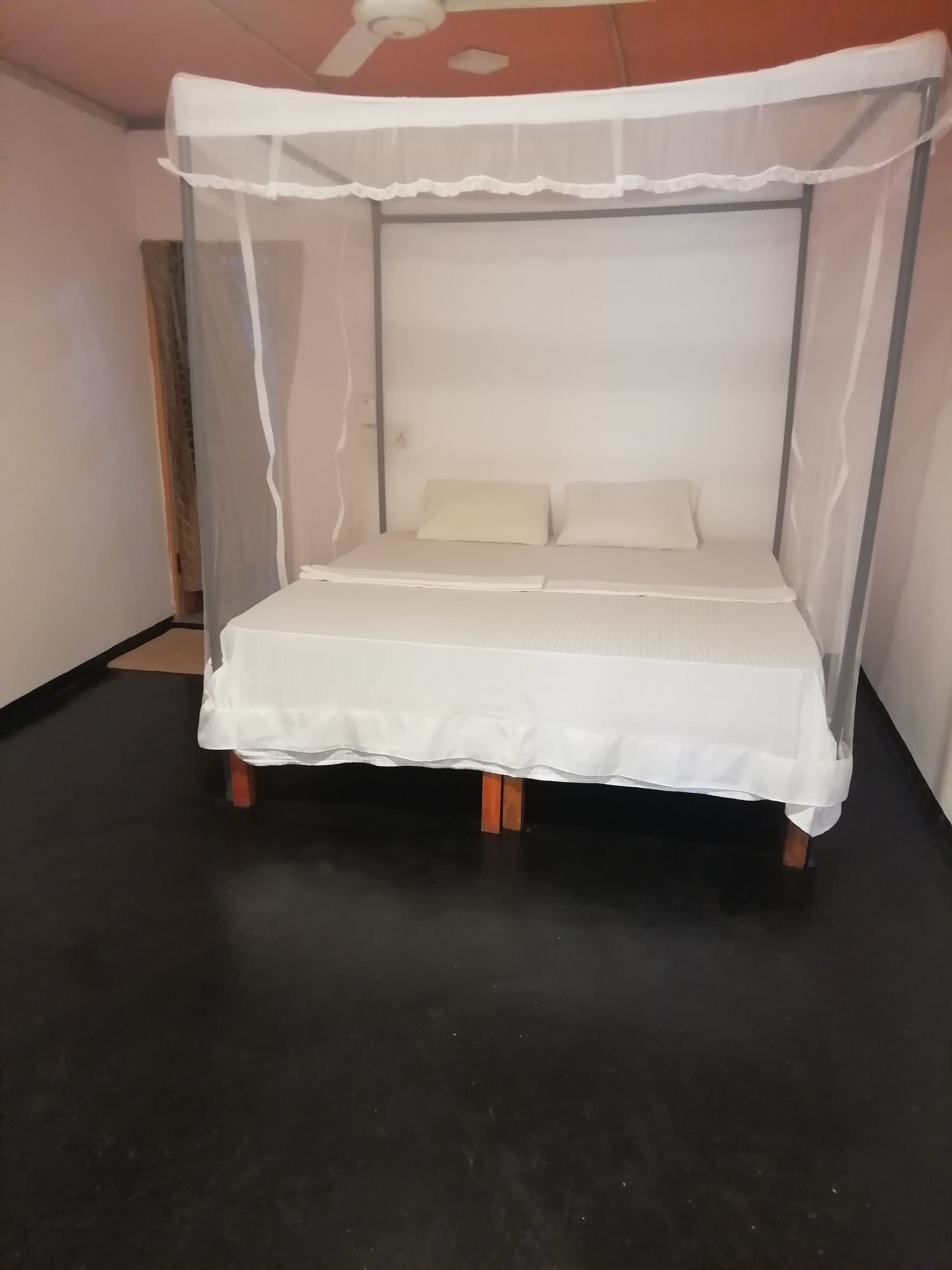 Quarto triplo standard, vista para o jardim | Vista do quarto