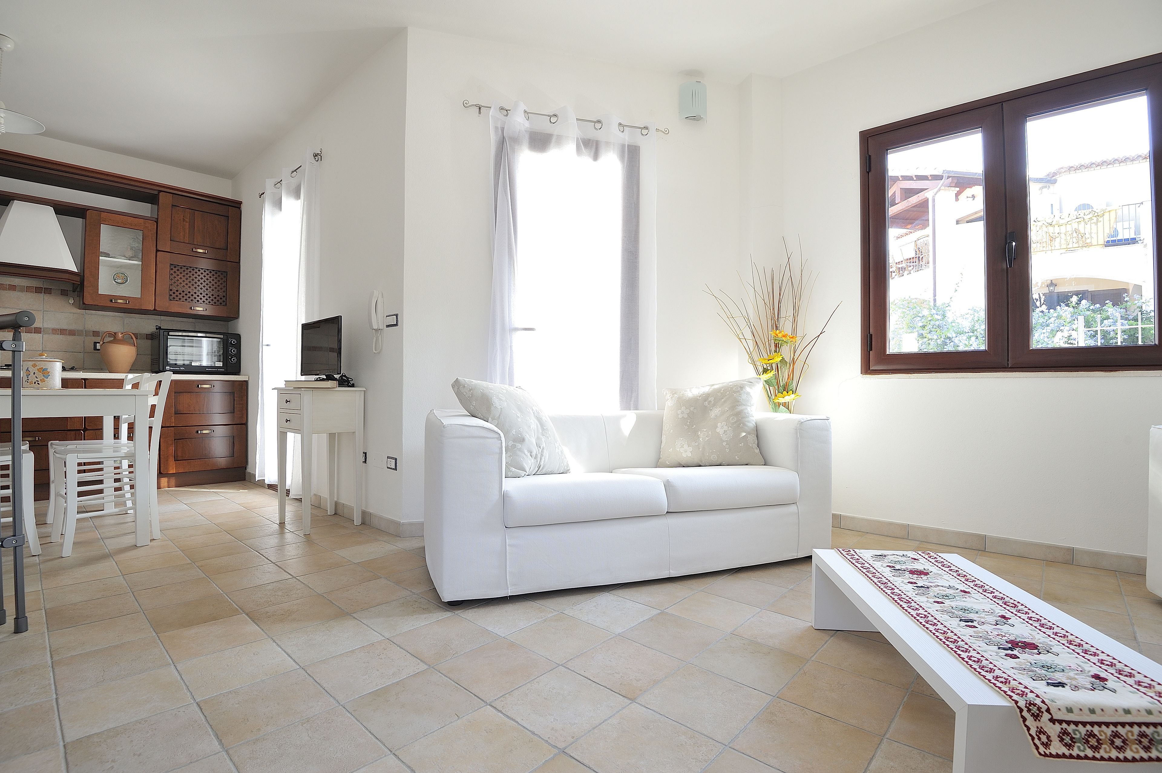 Apartamento, 2 quartos | Área de estar | TV de tela plana