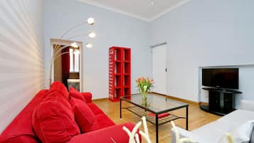 Apartamento, 1 quarto | Área de estar | TV de tela plana