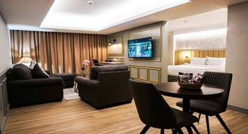 Suíte | Roupas de cama premium, frigobar (abastecido com itens grátis)