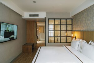 Suite Júnior | Roupa de alta qualidade, minibar grátis