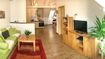 Apartamento Comfort | Sala de estar | Piso aquecido