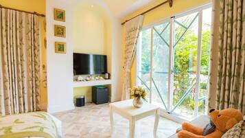 Quarto Quádruplo Elite, vista para o jardim | Vista do quarto