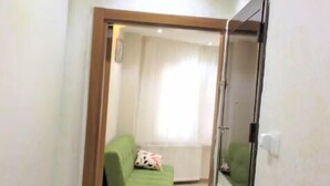 Apartamento, 2 quartos | Área de estar