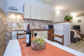 Apartamento, várias camas | Cozinha privada | Cooktop