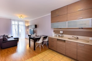Apartamento, 1 quarto (25/1) | Área de estar | TV de tela plana