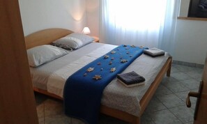 Apartamento, várias camas | Wi-Fi de cortesia, roupa de cama
