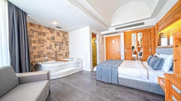 Suite Deluxe, banheira de hidromassagem, vista para o mar | 1 quarto, minibar, cofre com capacidade para portátil, secretária
