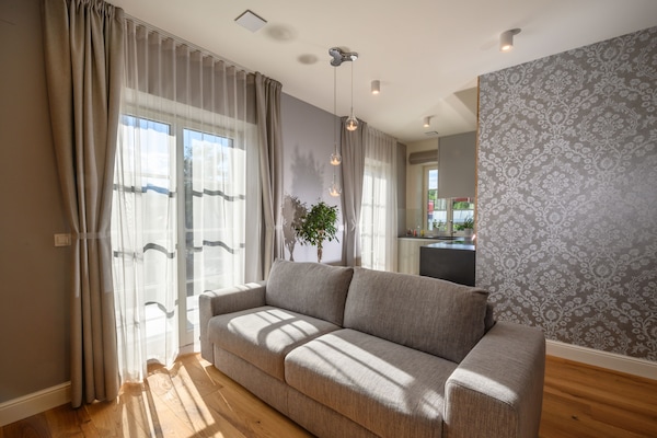 Apartamento Design, vista para a montanha | Sala | Smart TV, piso aquecido
