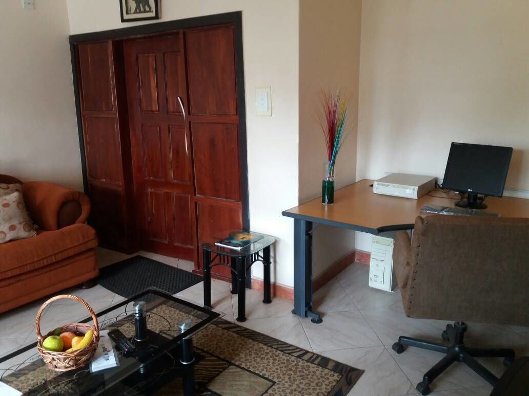 Apartamento premium, 2 quartos | Sala de estar | TV de tela plana