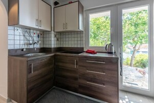Apartamento (A1) | Cozinha privada | Geladeira, fogão, cooktop, máquina de café expresso