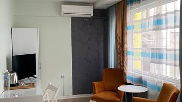 Quarto Triplo Económico | Sala de estar