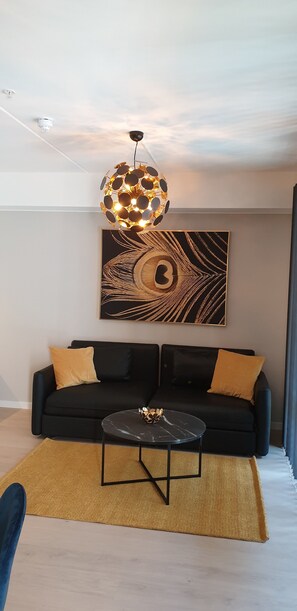 Apartamento Deluxe | Sala de estar | TV plasma 