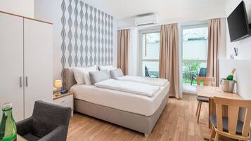 Suíte conforto, 1 cama King, cozinha americana (Dining Table) | Comodidades do quarto