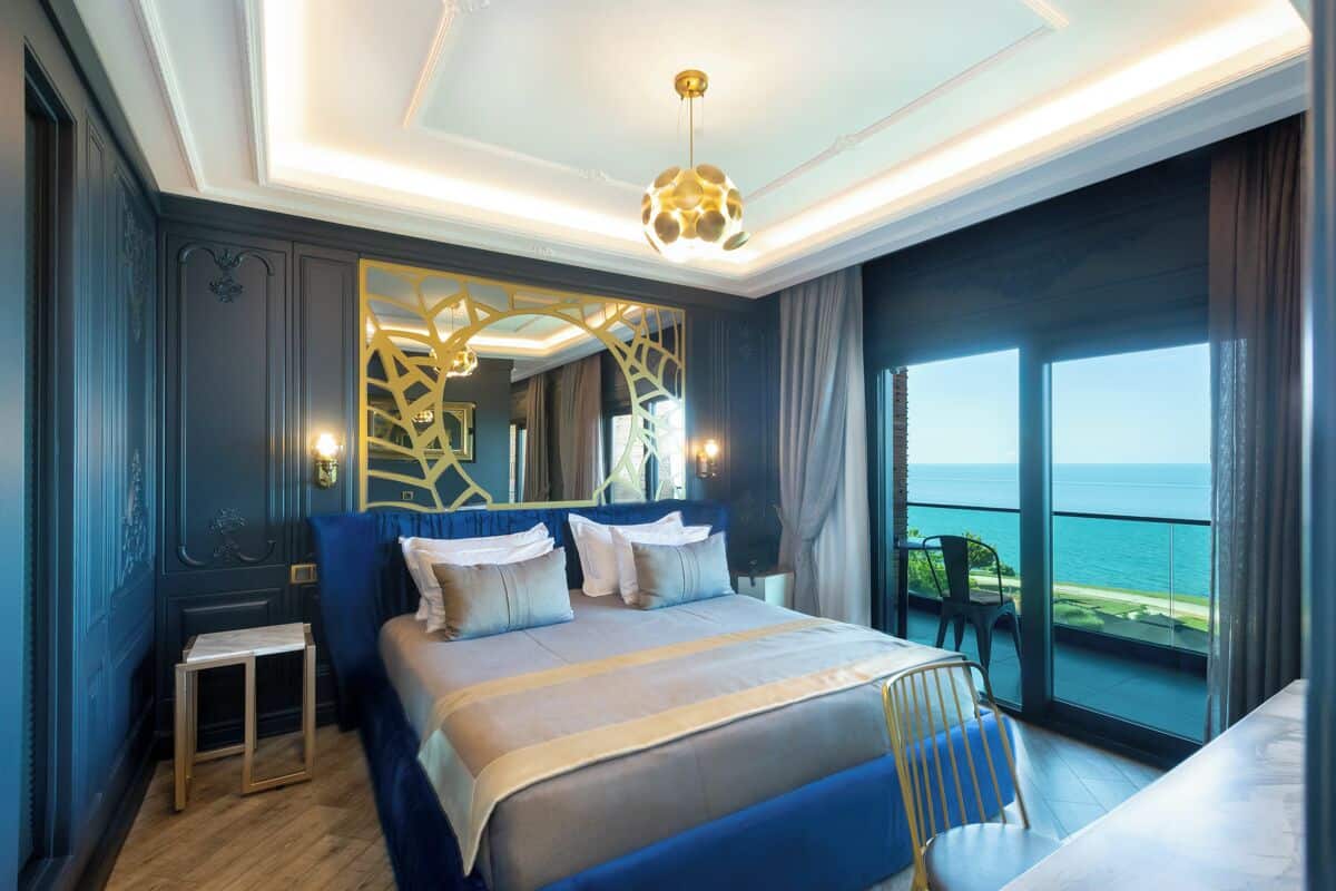 Suite, vista para o mar | Lençóis de algodão egípcio, roupa de alta qualidade, minibar 