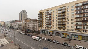 A multi-story building with a storefront labeled "КАЗКА" on the ground floor.