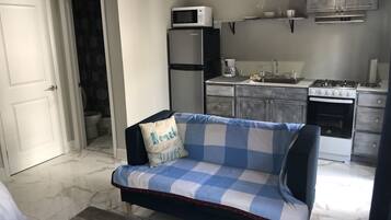 Apartamento Comfort | Sala de estar | Televisor