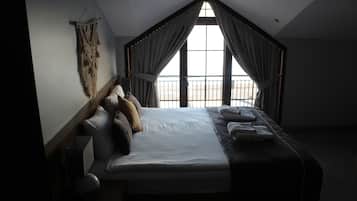 Quarto luxo, vista para o mar | Roupas de cama premium, frigobar, cortinas blackout