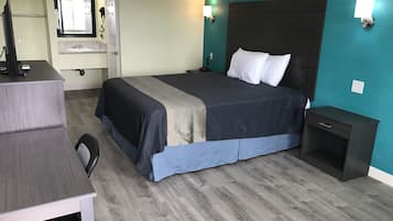Quarto Individual Deluxe | Com mobília individualizada, secretária, cortinas/cortinados opacos