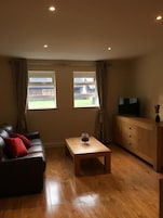Apartamento | Sala de estar | TV de tela plana