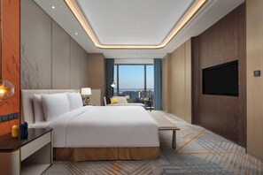 Suíte estúdio luxo, 1 cama King | Roupas de cama premium, edredons de pluma, frigobar, cofres nos quartos