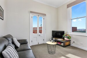 Apartamento urbano | Área de estar | TV LED